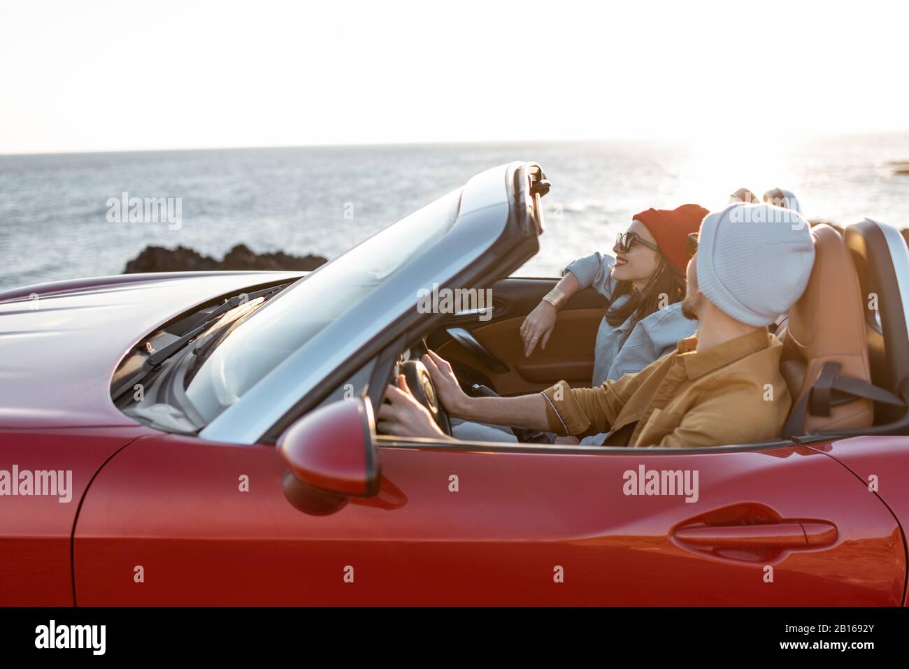 Joyful Couple Enjoying Vacations Driving Together Convertible Car On