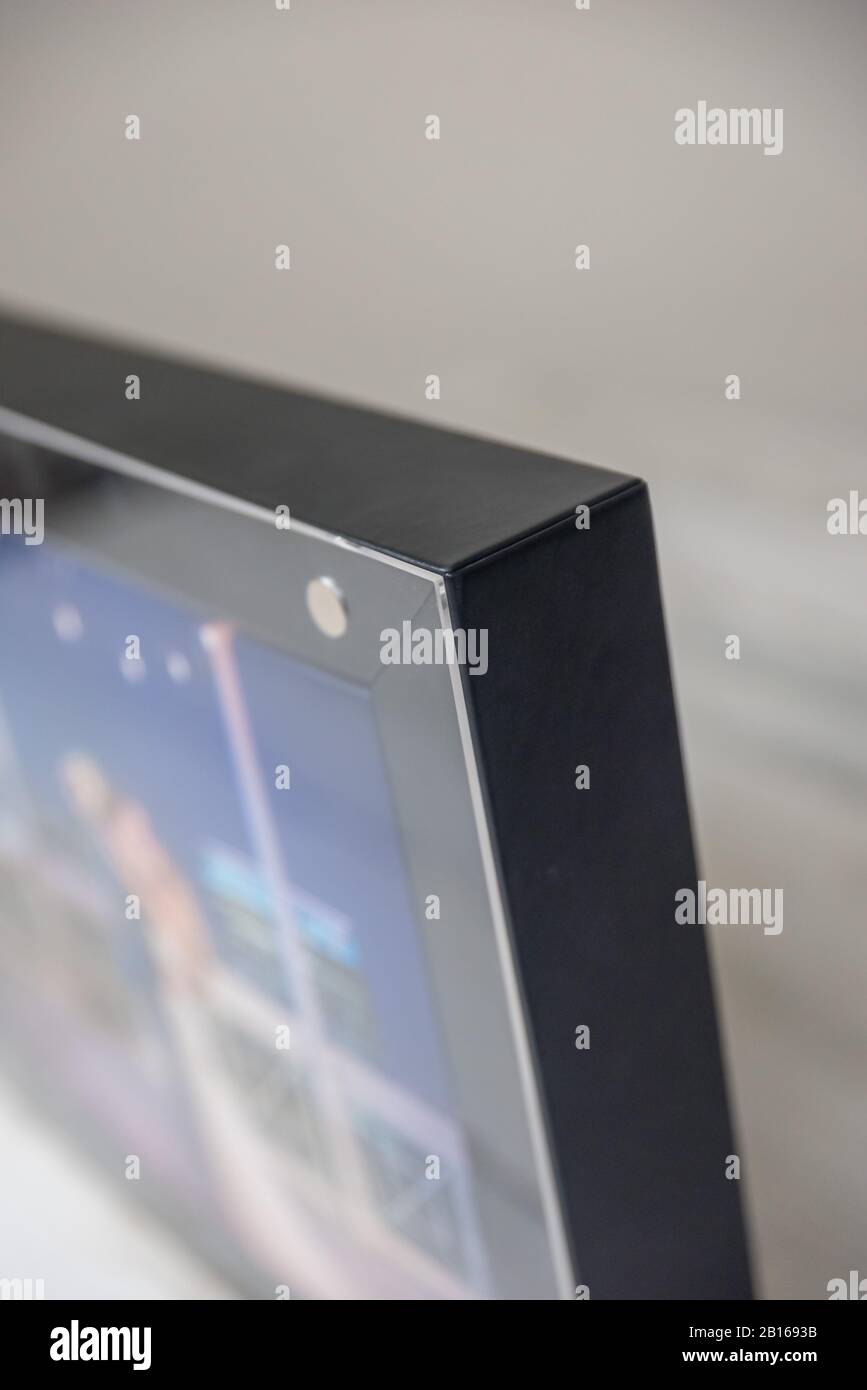 Corner view of black album box with magnetic plexiglass lid with ...