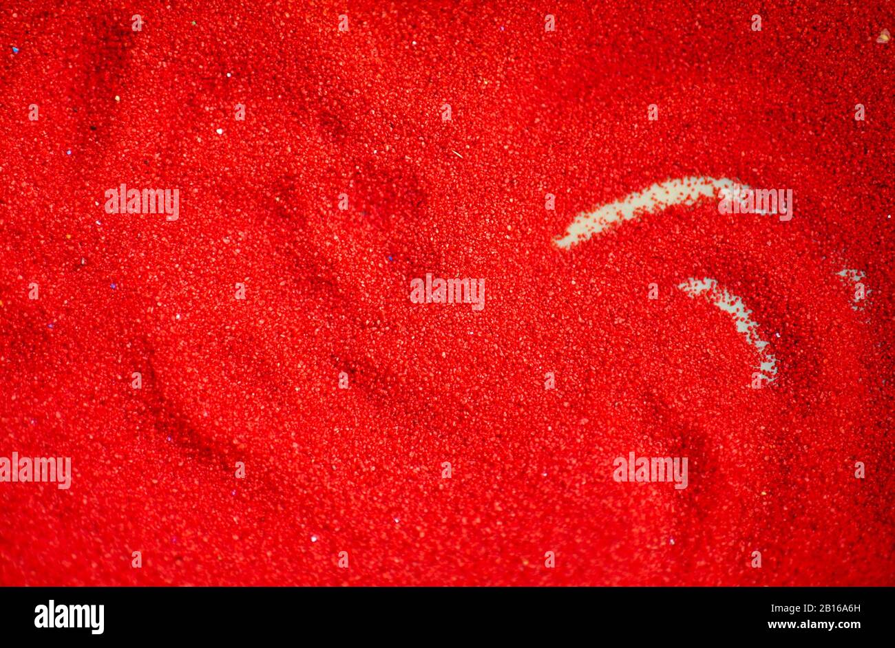 Red decorative sand Stock Photo - Alamy