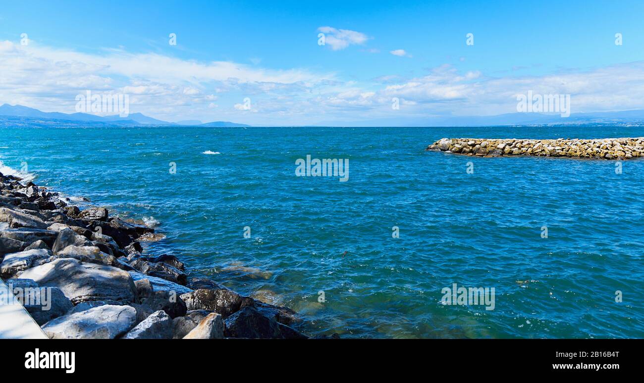 Entrance to the harbor Ouchi with the stone mole and coast, big symbol ...