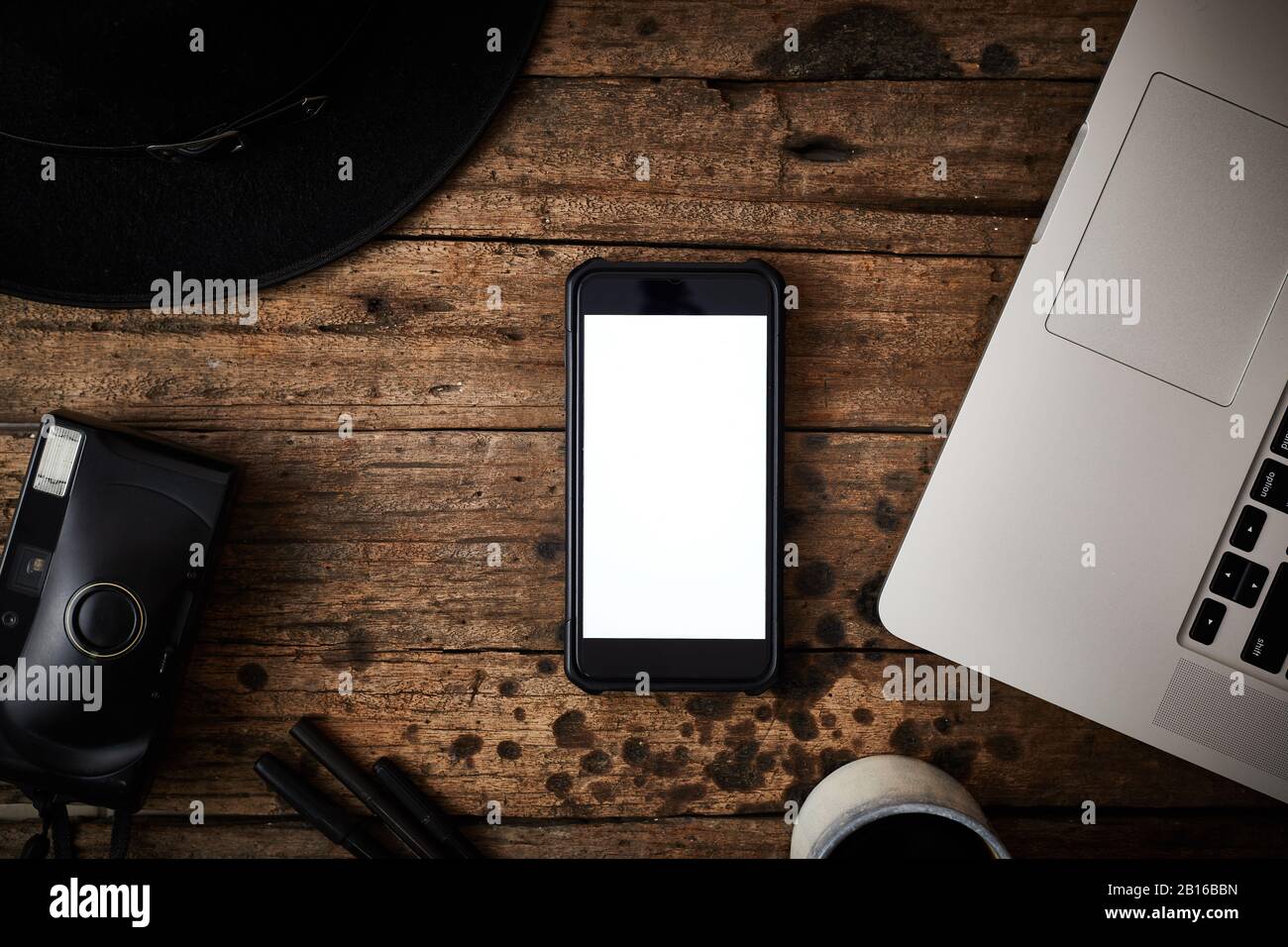 Smartphone white screen on wooden table.Top view Stock Photo - Alamy