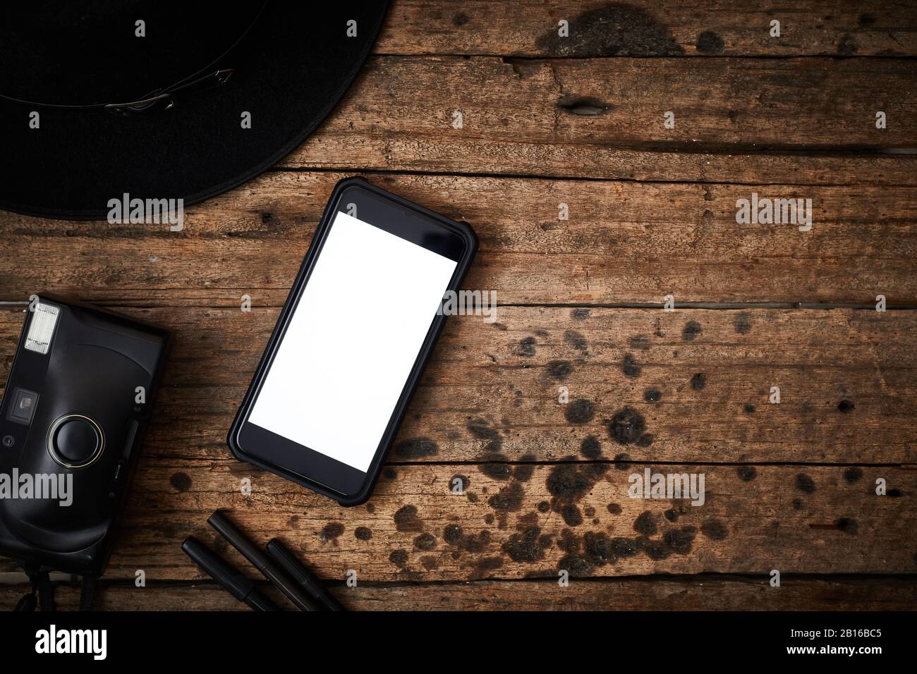 Smartphone white screen on wooden table.Top view Stock Photo - Alamy