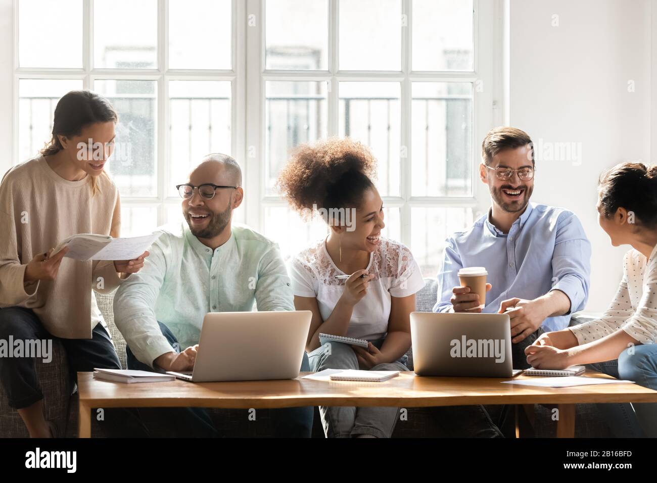 Multinational students studying together working on common research ...