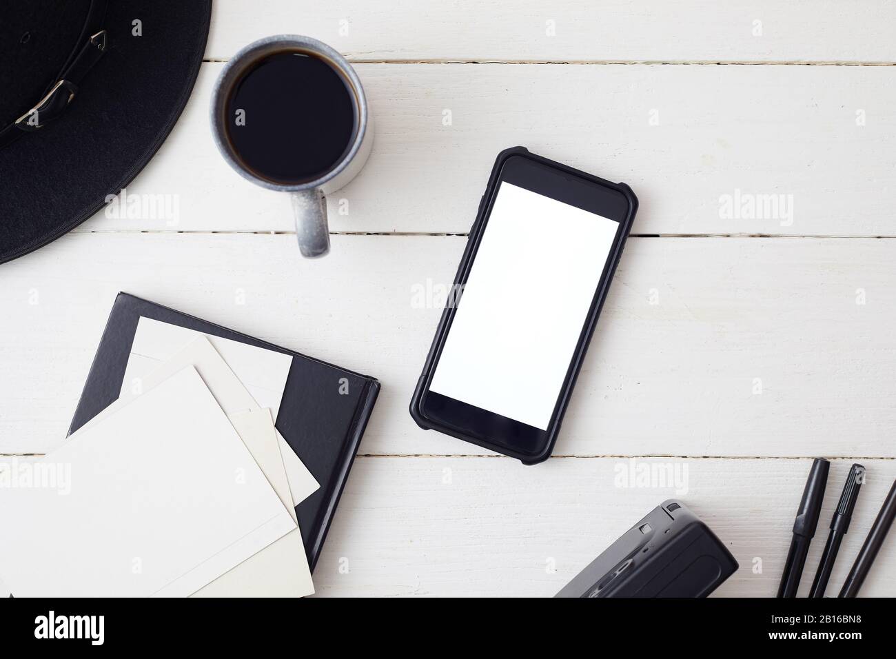 White office desk table with smartphone.Top view Stock Photo - Alamy