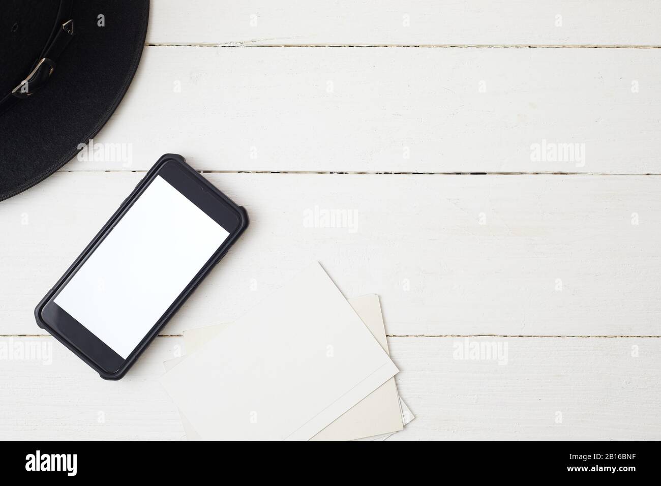 White office desk table with smartphone.Top view Stock Photo - Alamy