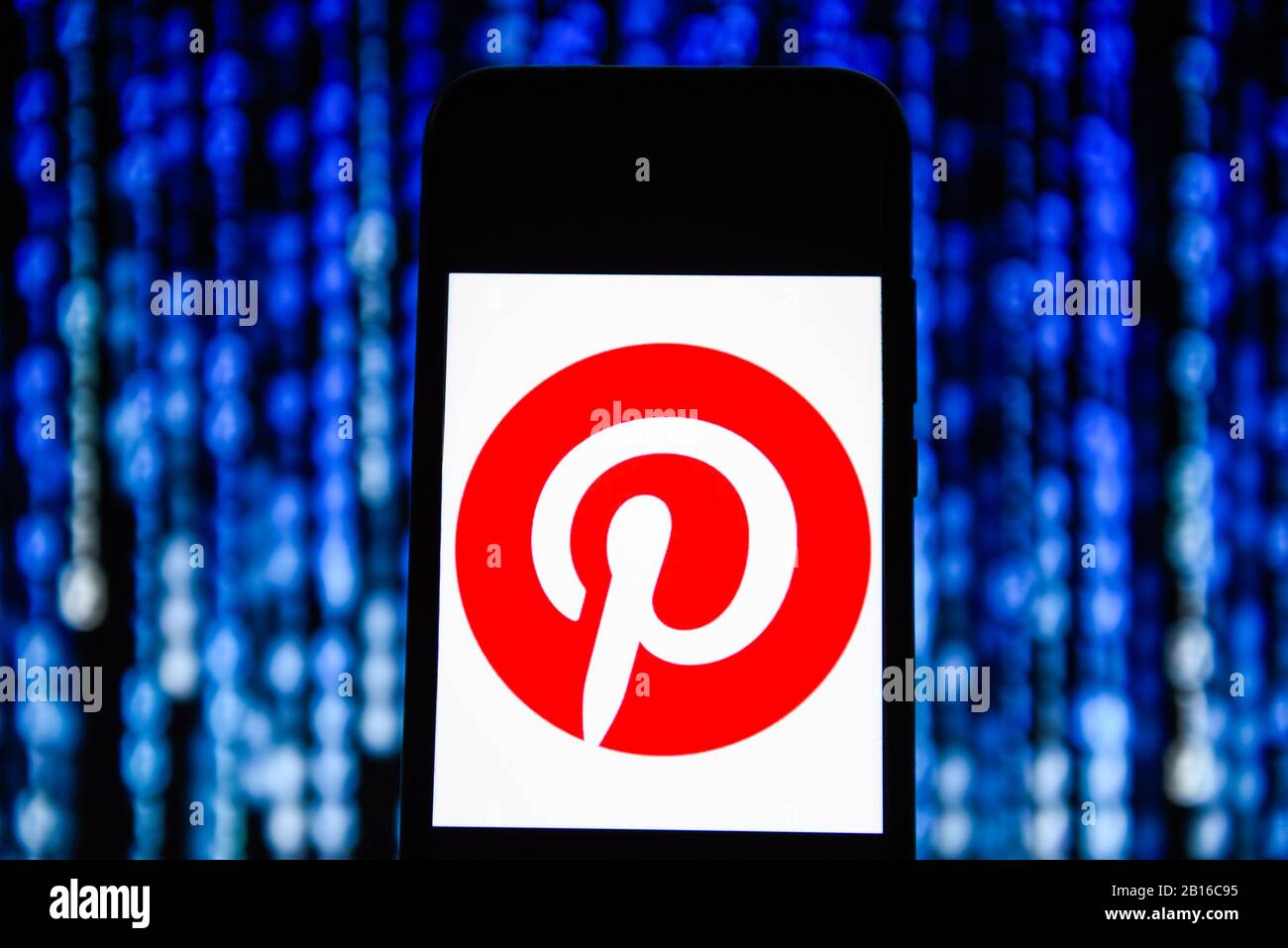 In this photo illustration a Pinterest logo seen displayed on a ...