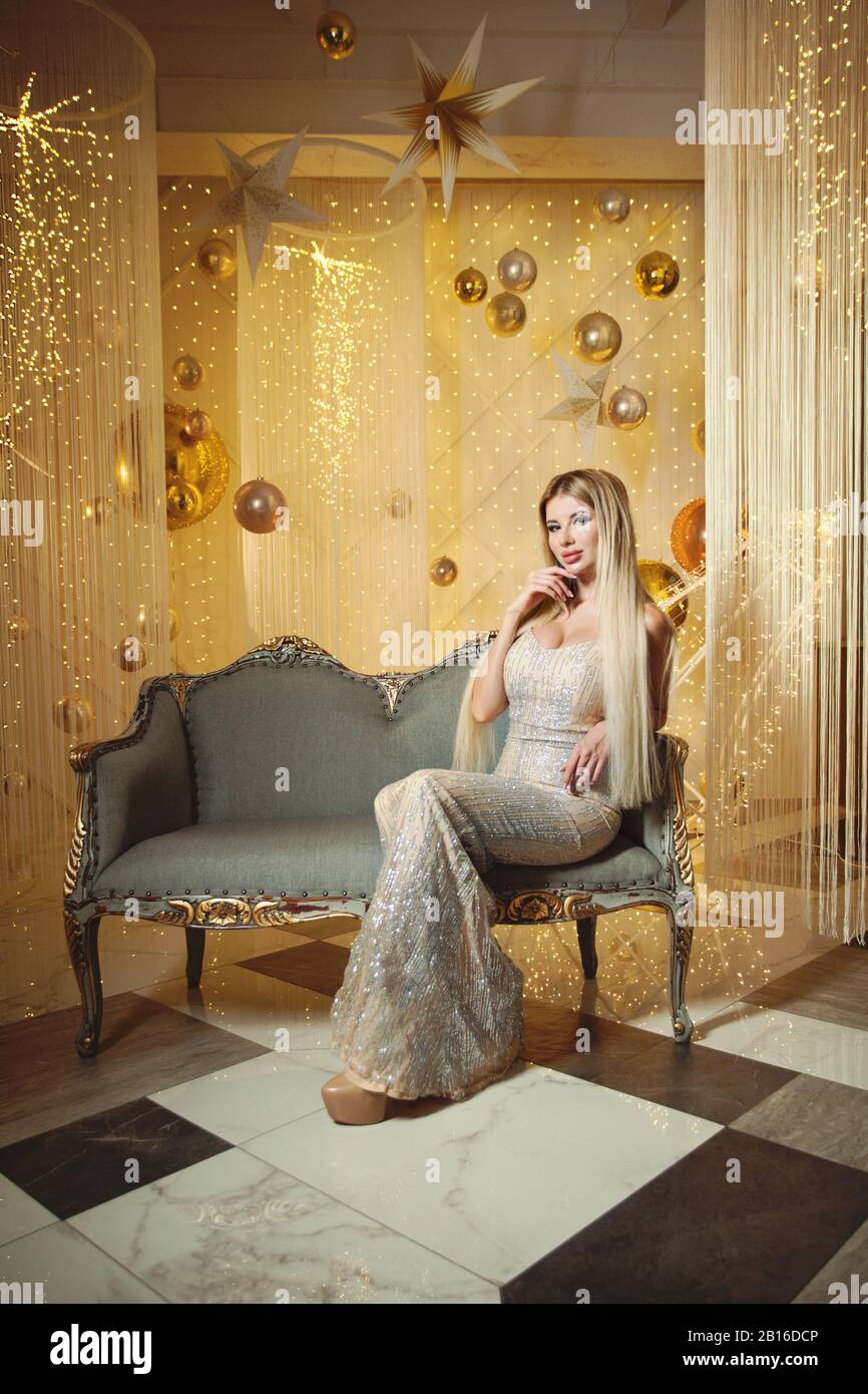 Beautiful fashionable model woman on vintage sofa Stock Photo - Alamy