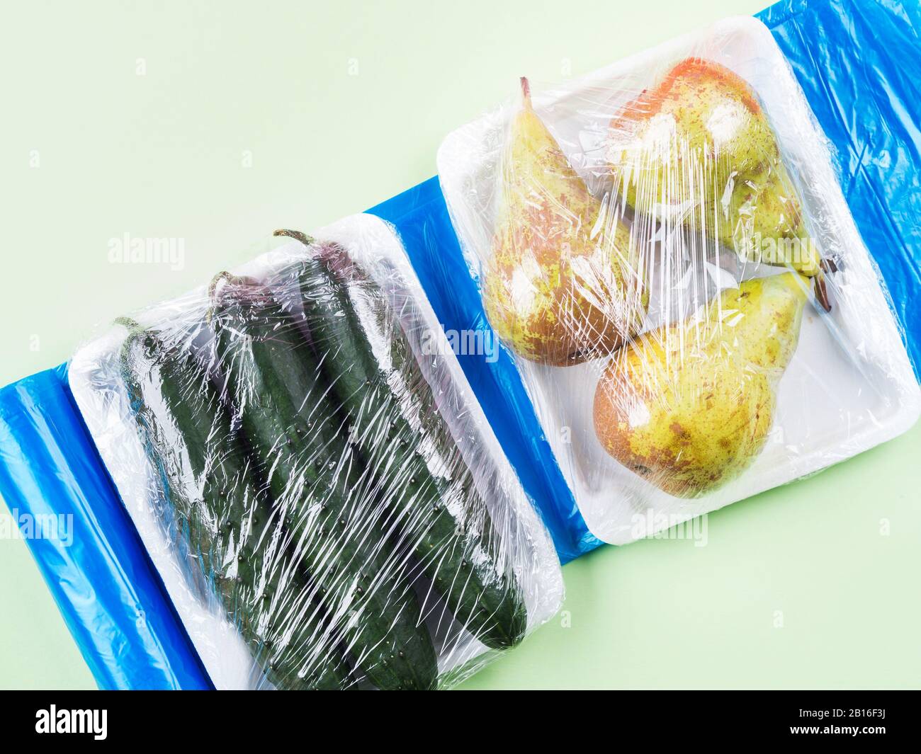 Fresh produce wrapped in plastic film Stock Photo - Alamy