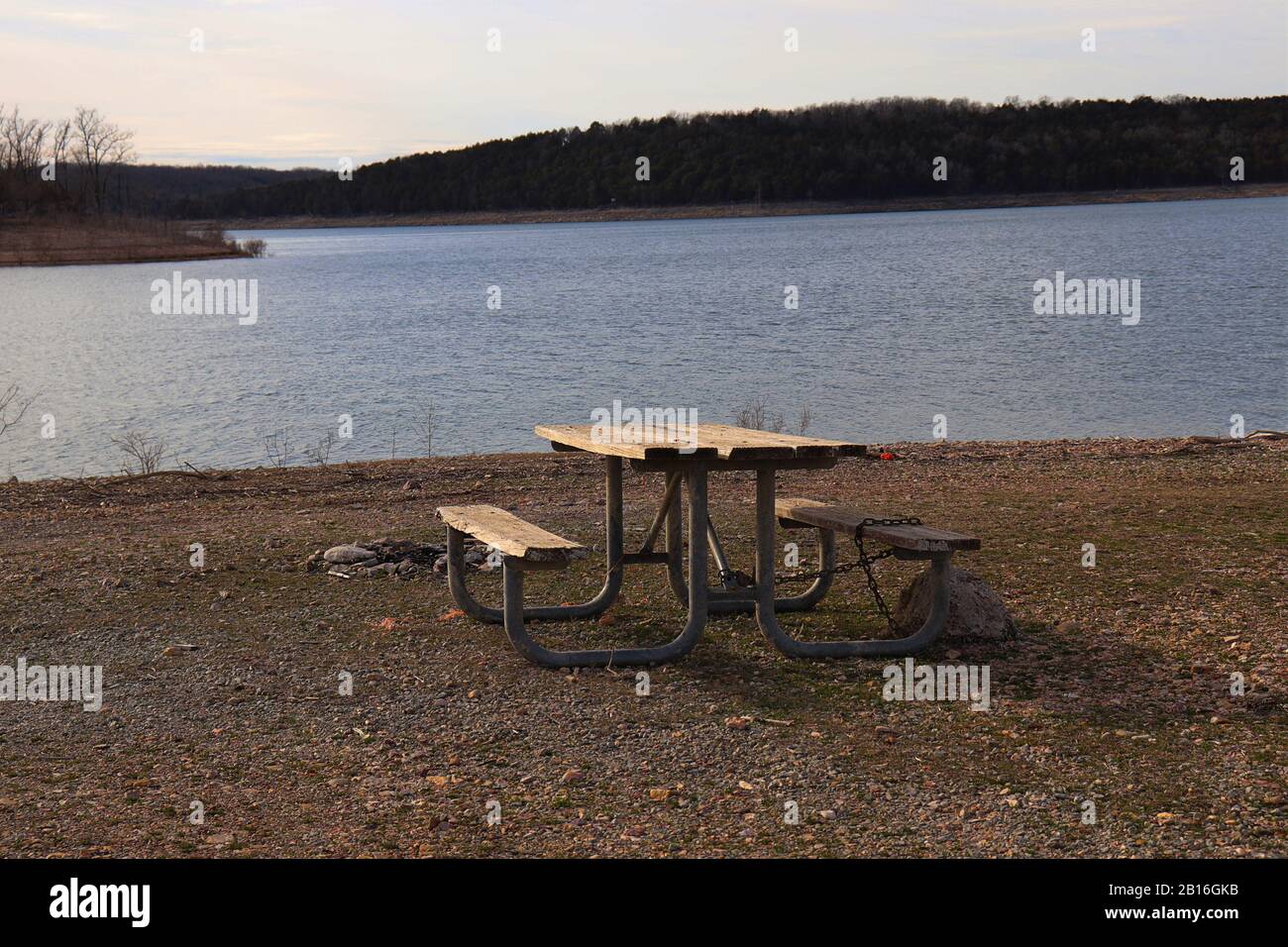 A picnic table beside a lake Stock Photo - Alamy