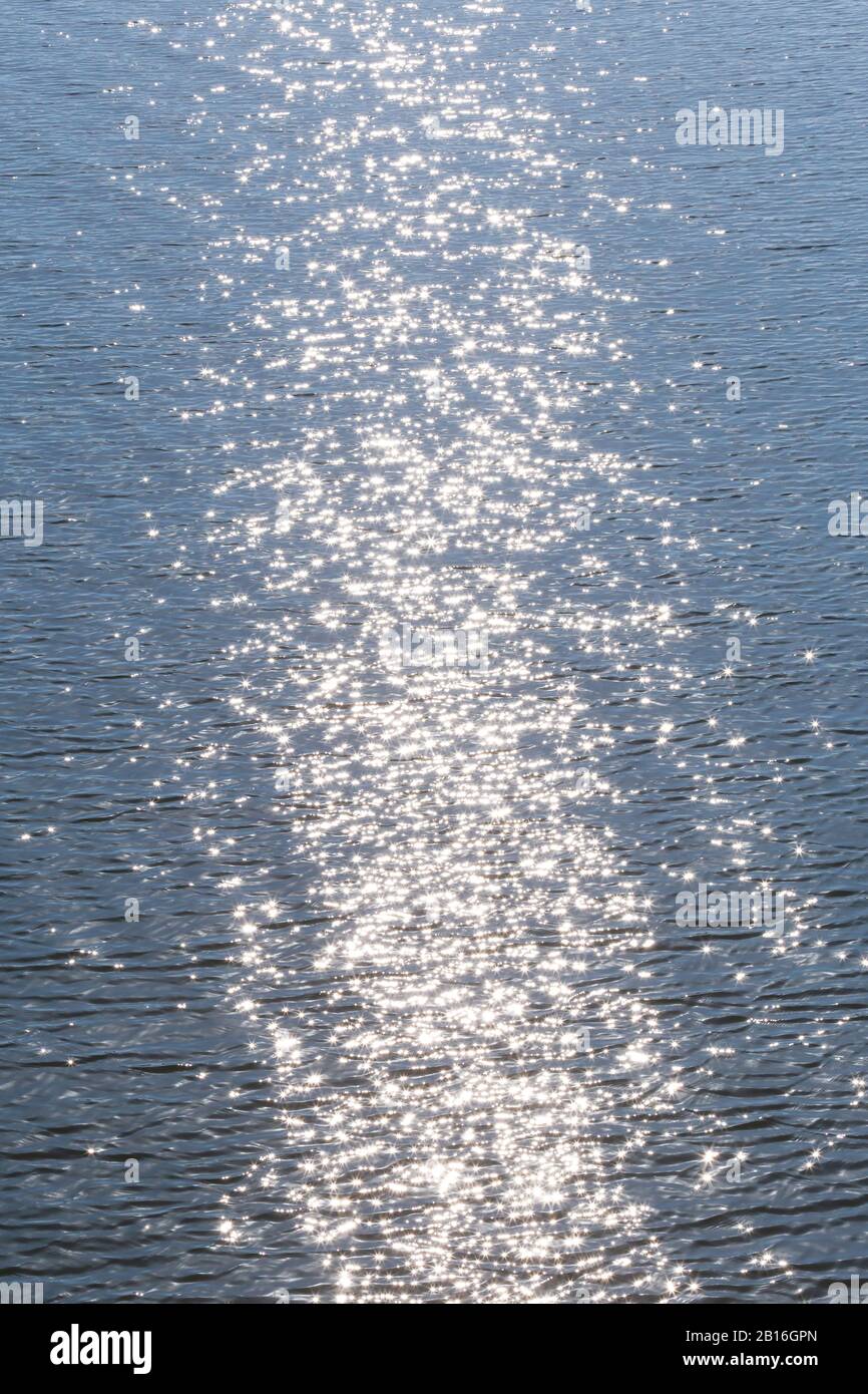 view on sunshine glare on water surface Stock Photo - Alamy