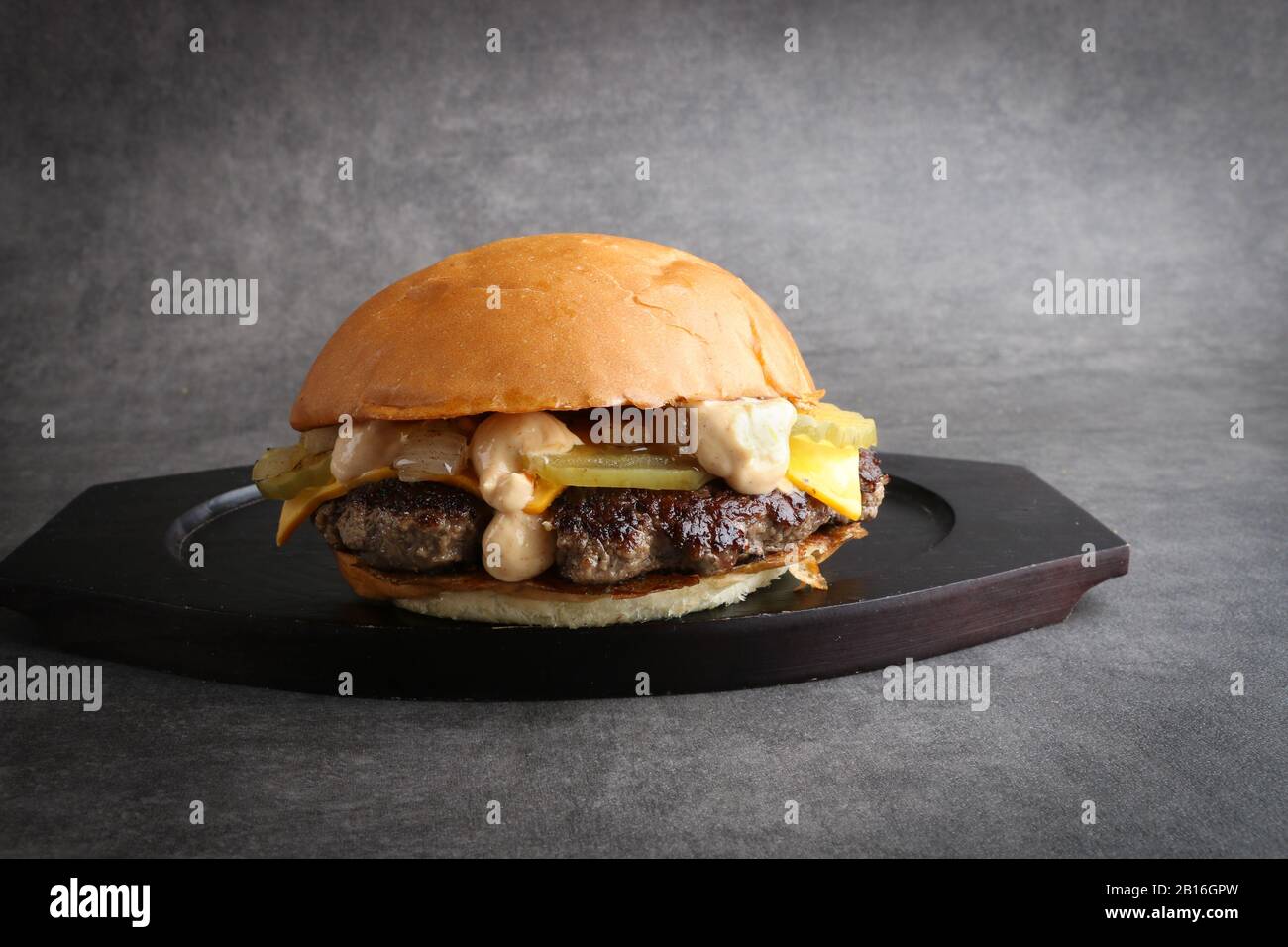 Beef burger - Classic cheese burger with beef patty, pickles, cheese ...