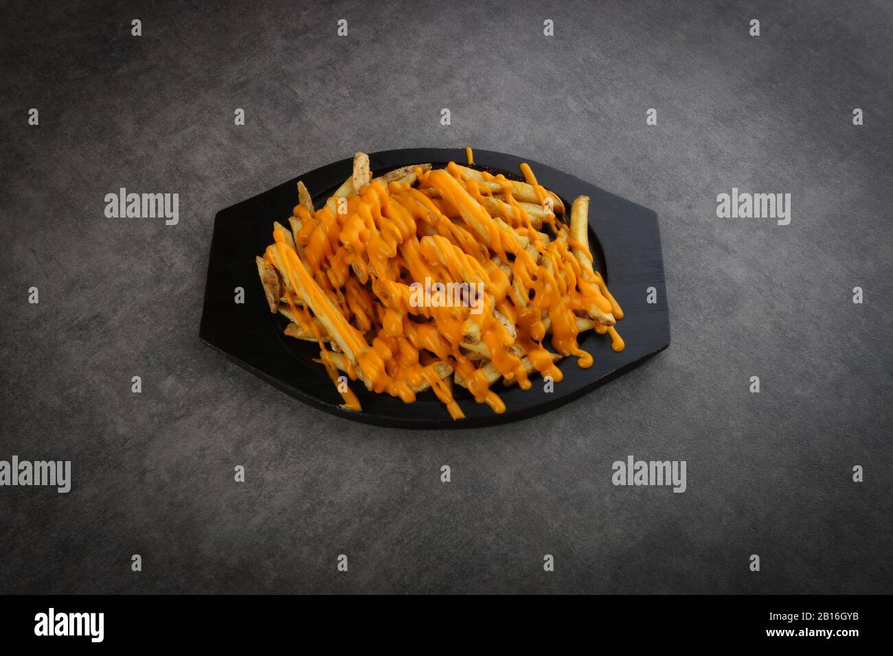 Cheddar cheese fries hi-res stock photography and images - Alamy
