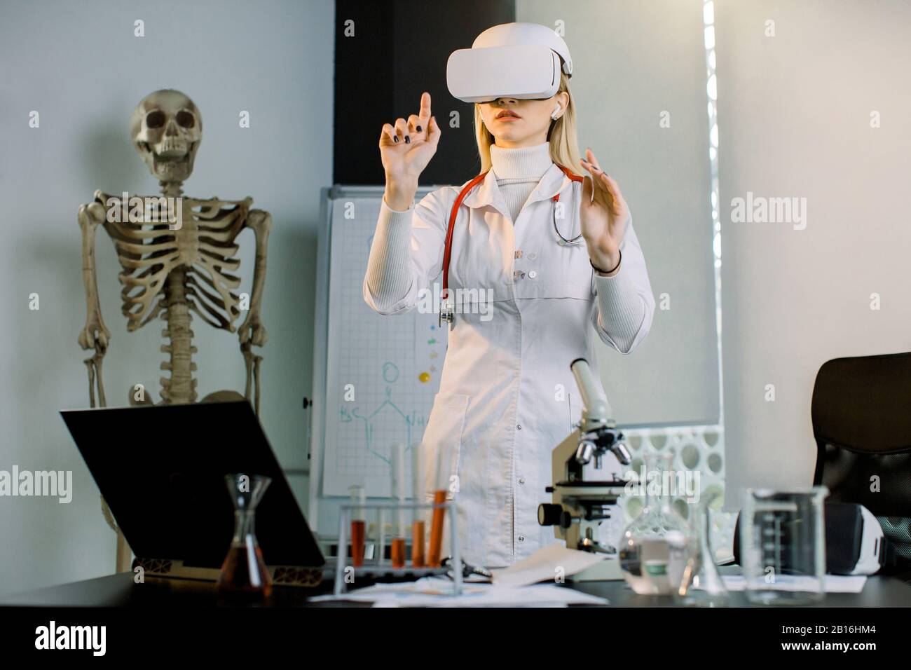 Woman doctor, virologist or scientist with stethoscope using VR virtual ...