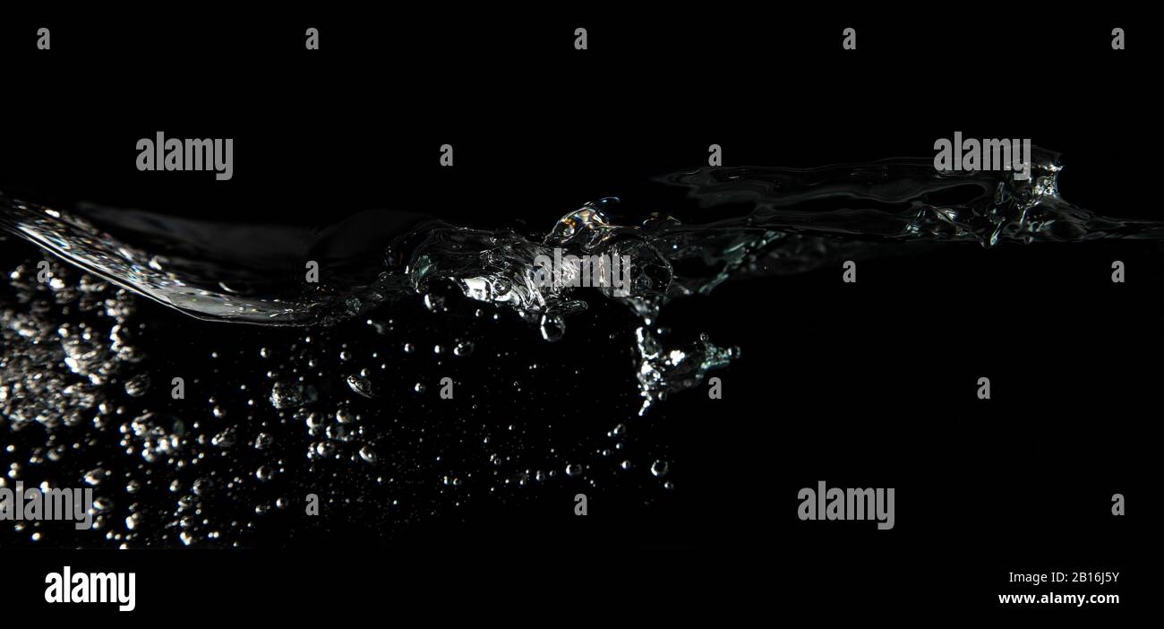 Splash of water. Isolate on black background Stock Photo - Alamy