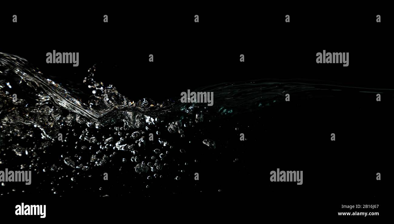 Splash of water. Isolate on black background Stock Photo - Alamy