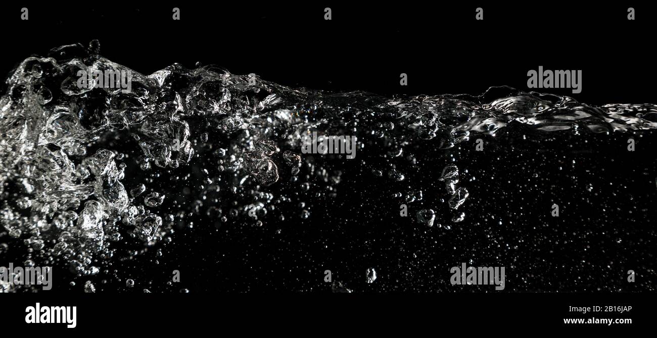 Splash of water. Isolate on black background Stock Photo - Alamy