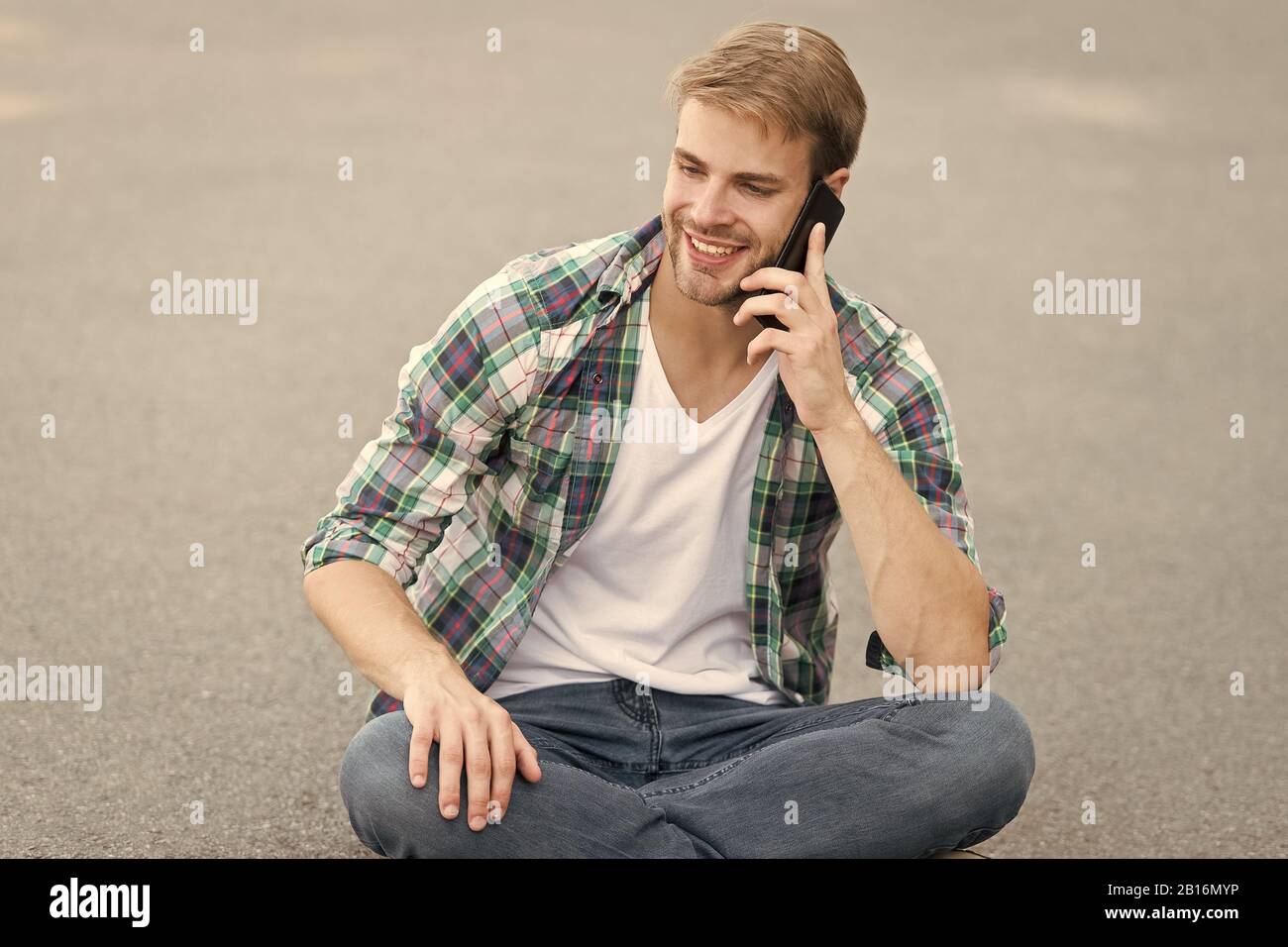 nice talk. man sit on ground. carefree student. free time spending ...