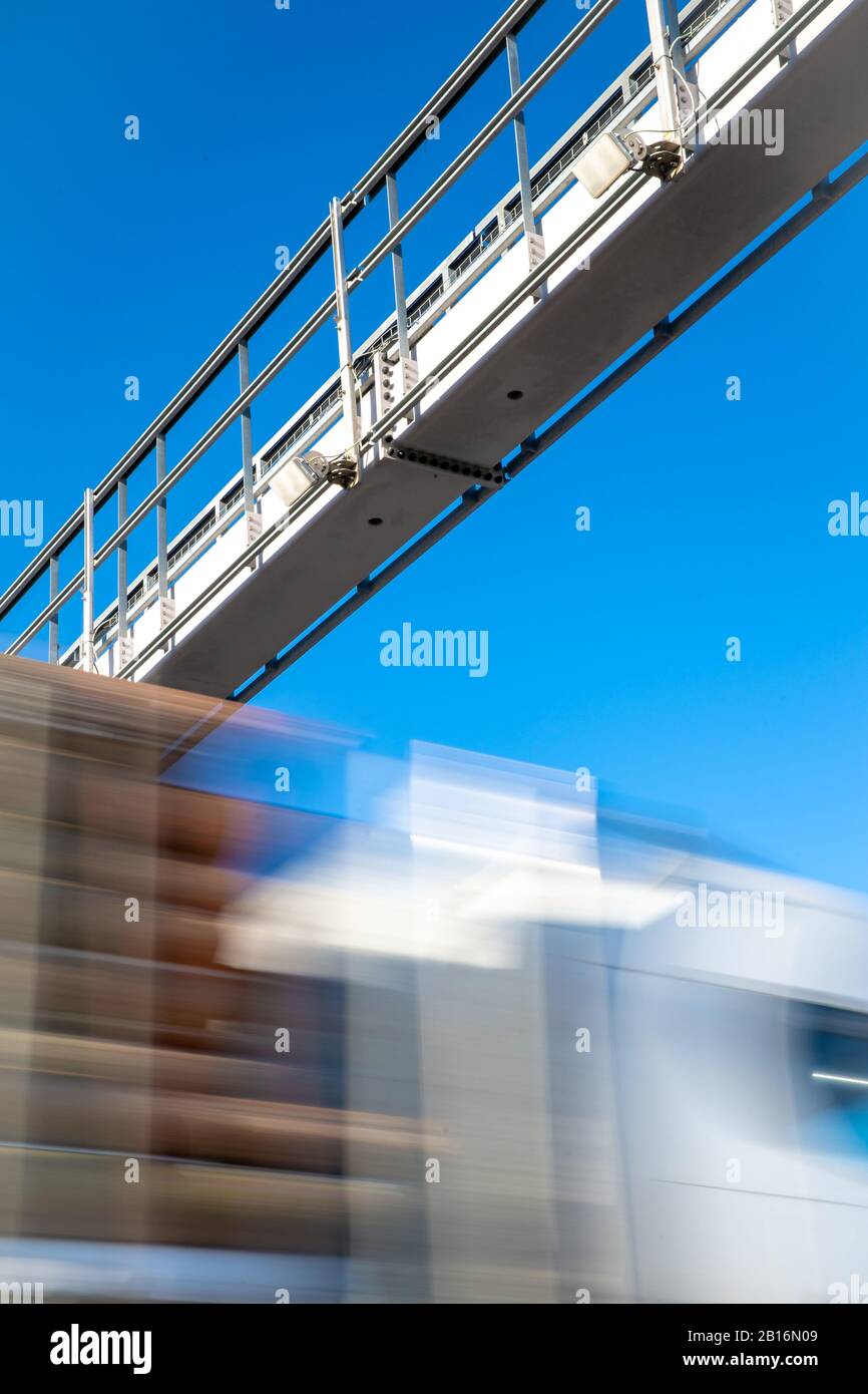 truck drive through the highway through the toll gate, toll charges ...