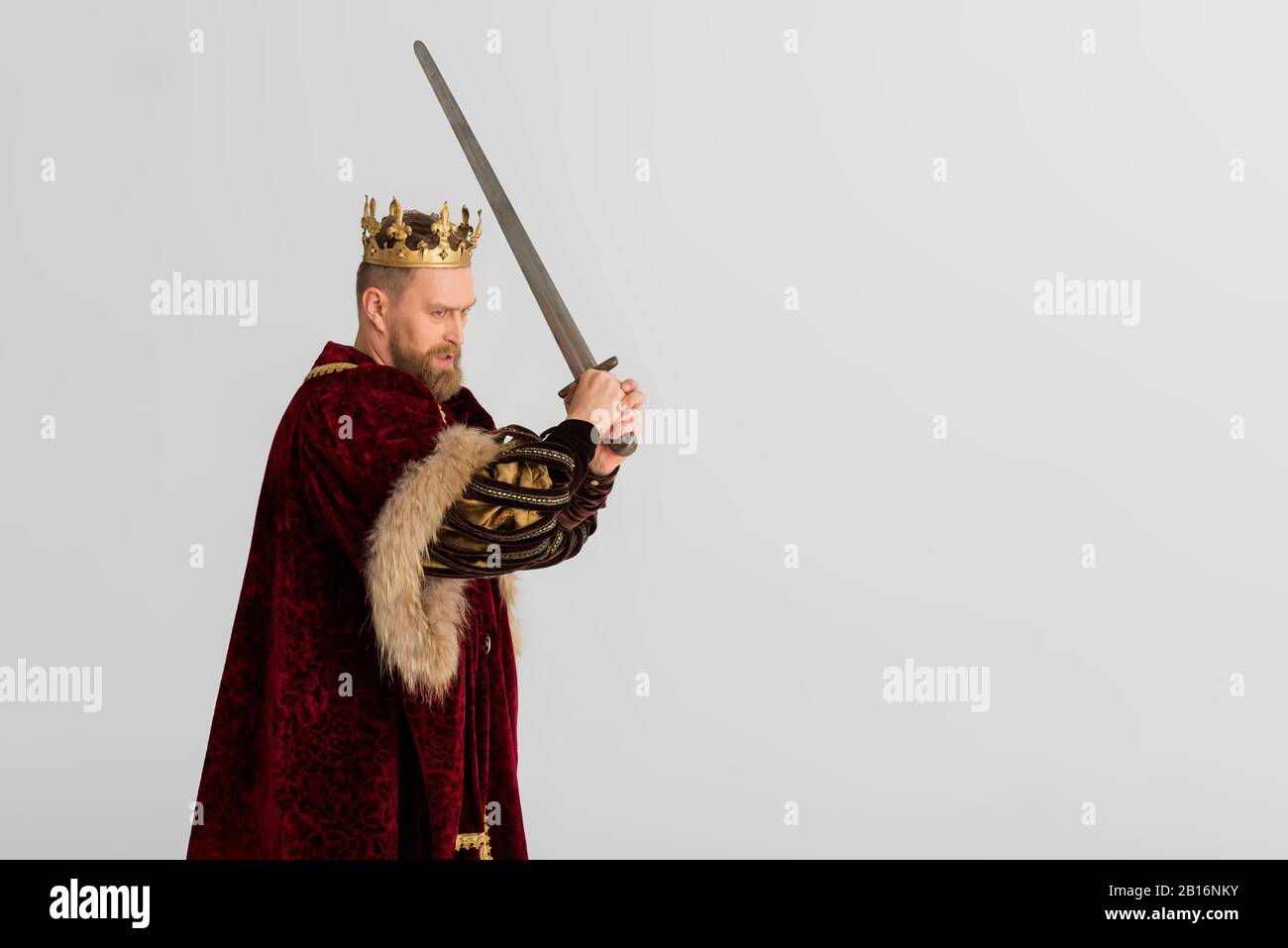 king with crown holding sword and fighting isolated on grey Stock Photo ...