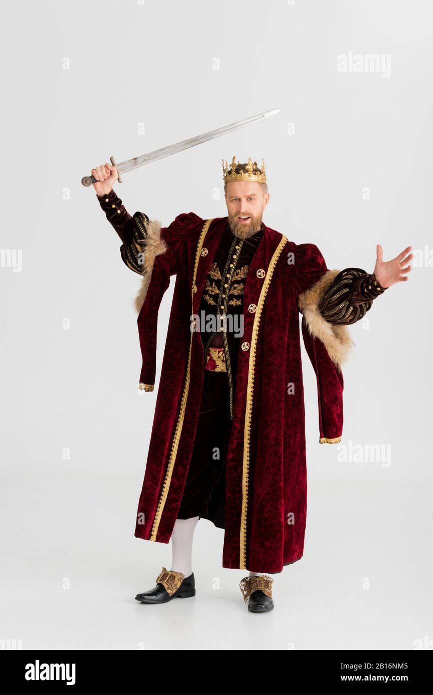 angry king with crown holding sword isolated on grey Stock Photo - Alamy