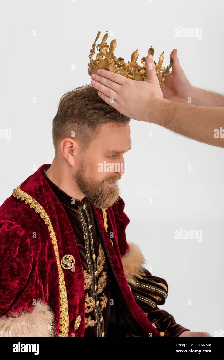 Men putting crown hi-res stock photography and images - Alamy