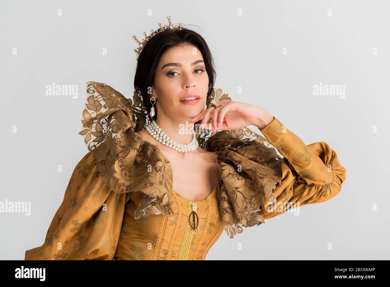 attractive queen with crown looking at camera isolated on grey Stock ...