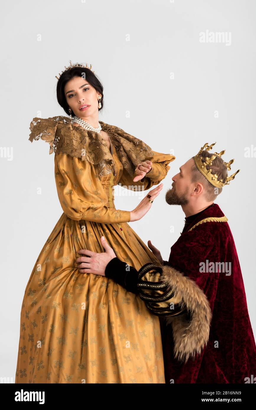 king asking for forgiveness queen in crown isolated on grey Stock Photo ...