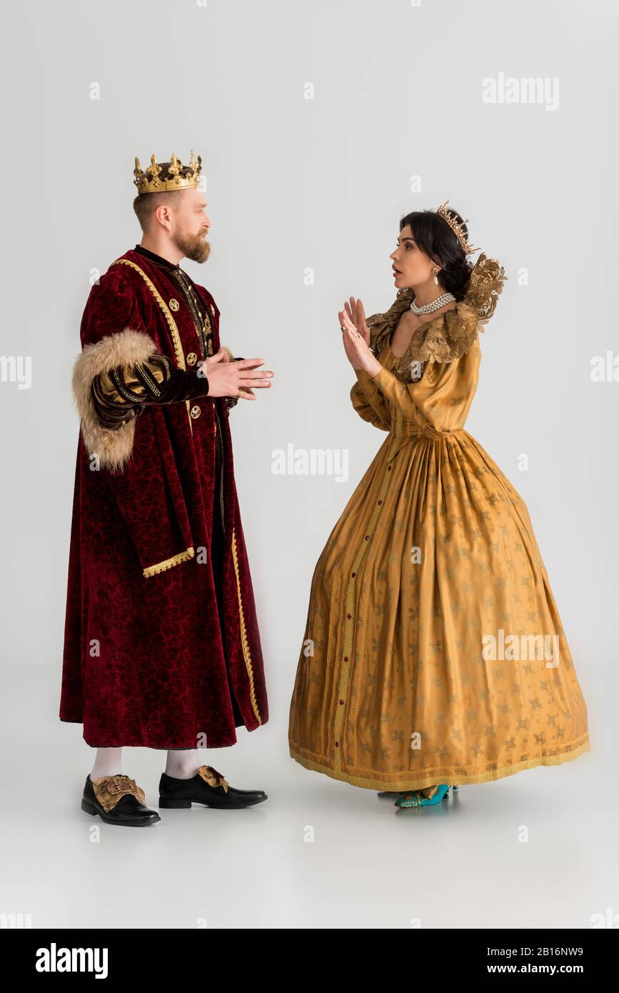side view of shocked queen showing no gesture to king with crown on ...