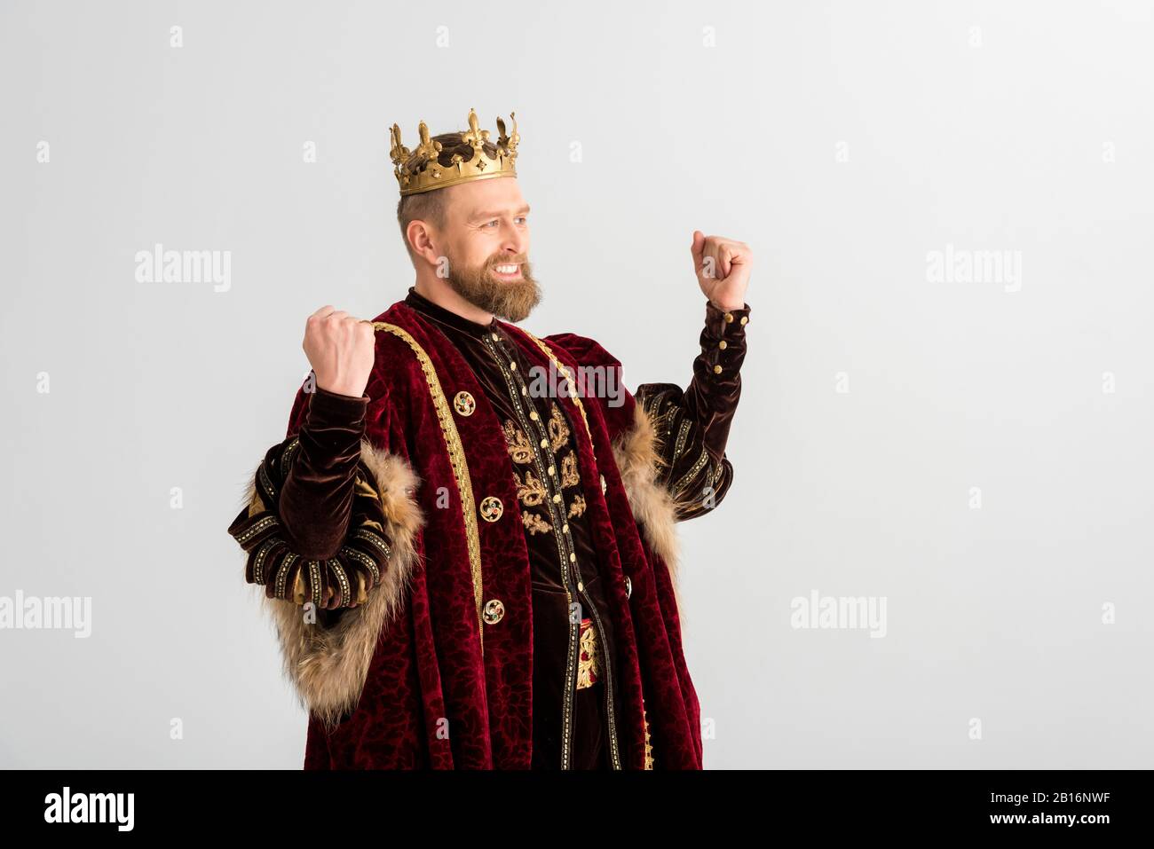 happy king with crown showing yes gesture isolated on grey Stock Photo ...