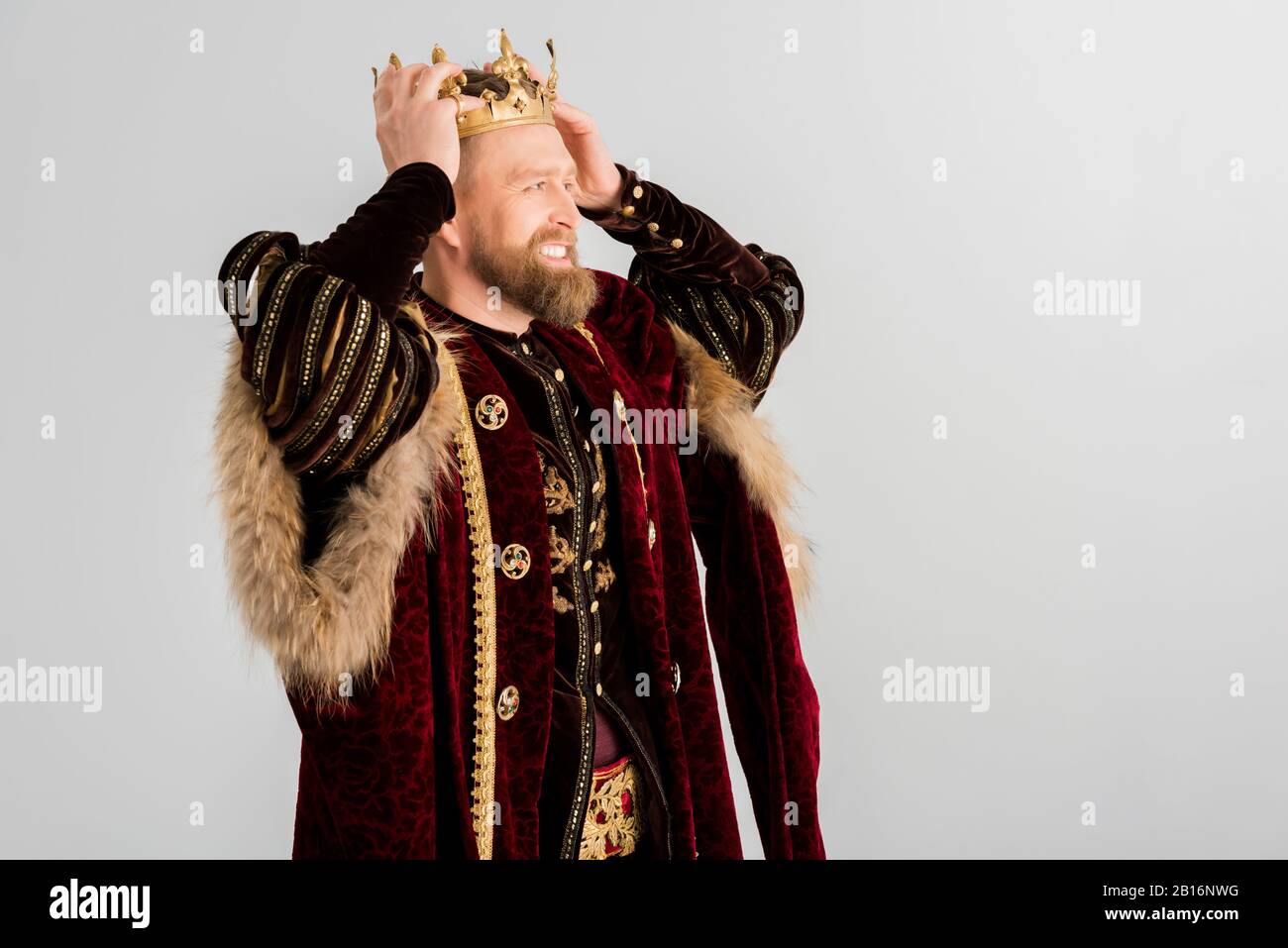 smiling king wearing crown on head isolated on grey Stock Photo - Alamy