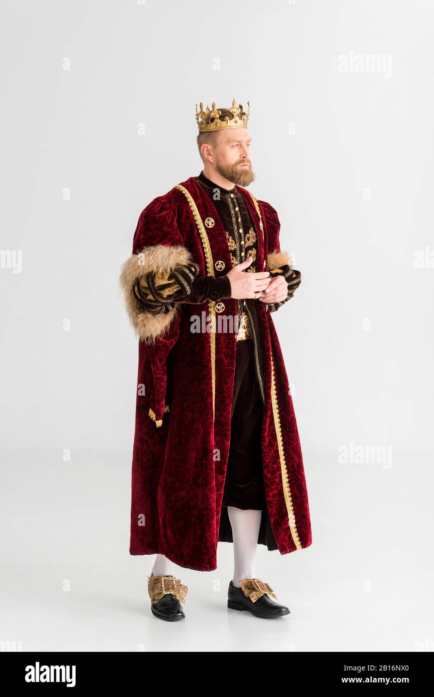 handsome king with crown looking away on grey background Stock Photo ...