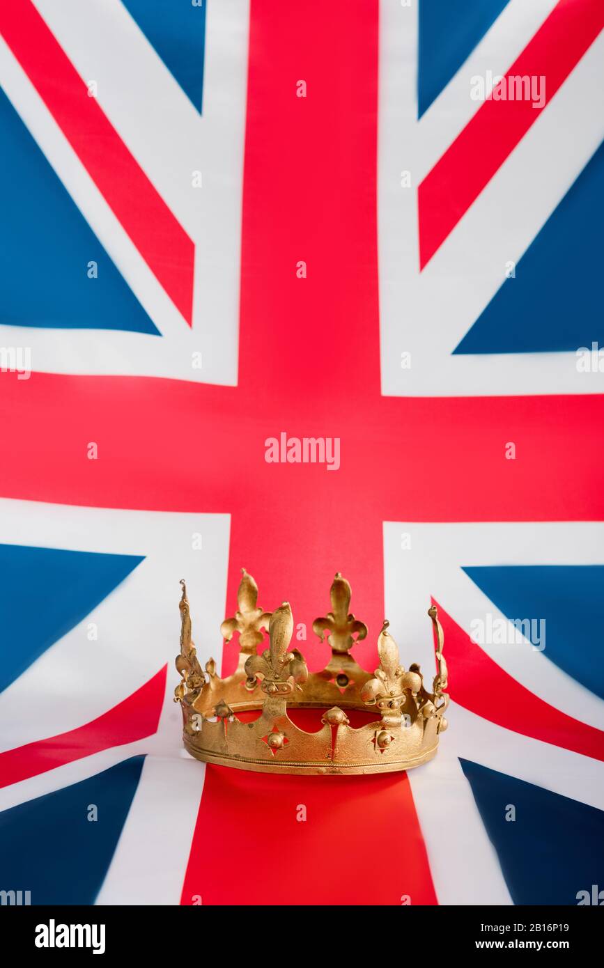 golden crown on british flag with copy space Stock Photo - Alamy