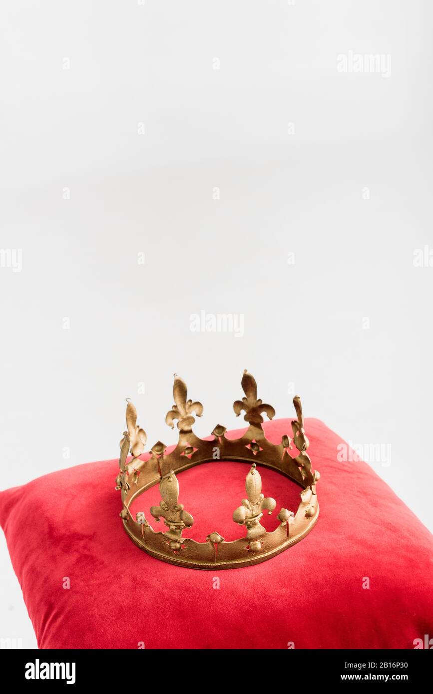 royal crown on red pillow isolated on white Stock Photo - Alamy