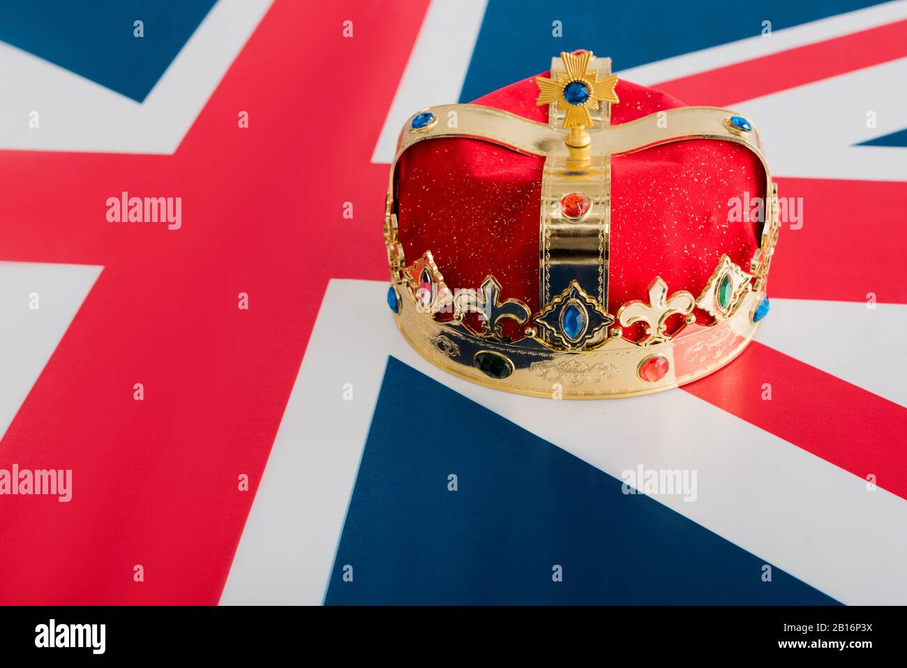 golden crown on british flag with copy space Stock Photo - Alamy