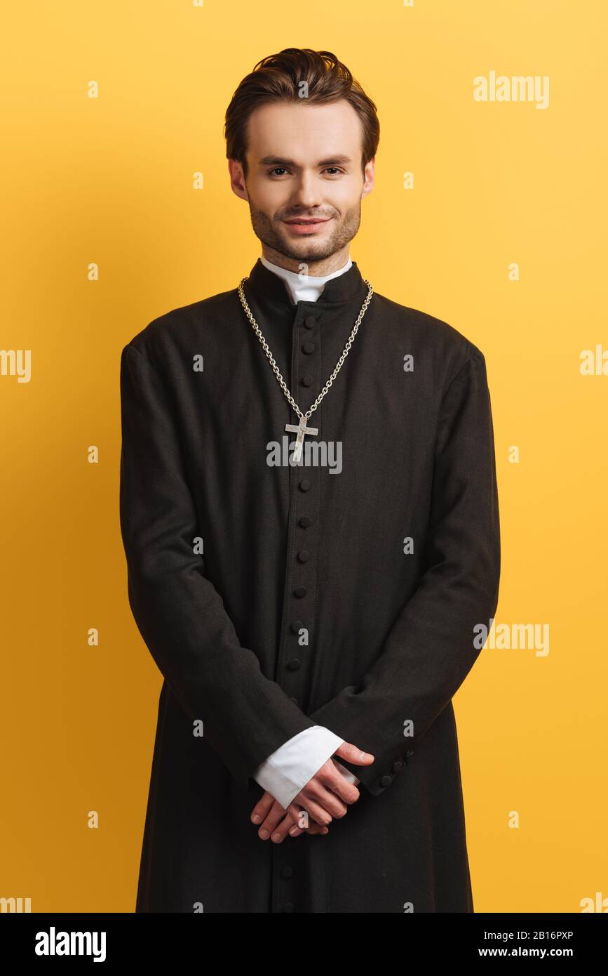 Young religious happy priest hi-res stock photography and images - Alamy