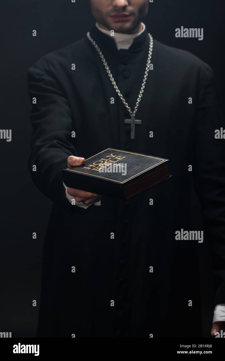 Catholic priest holding holy bible hi-res stock photography and images ...