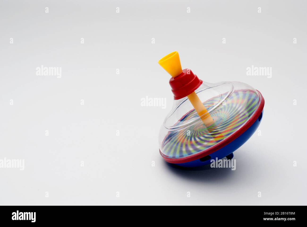 Peg top isolated on white background Stock Photo - Alamy