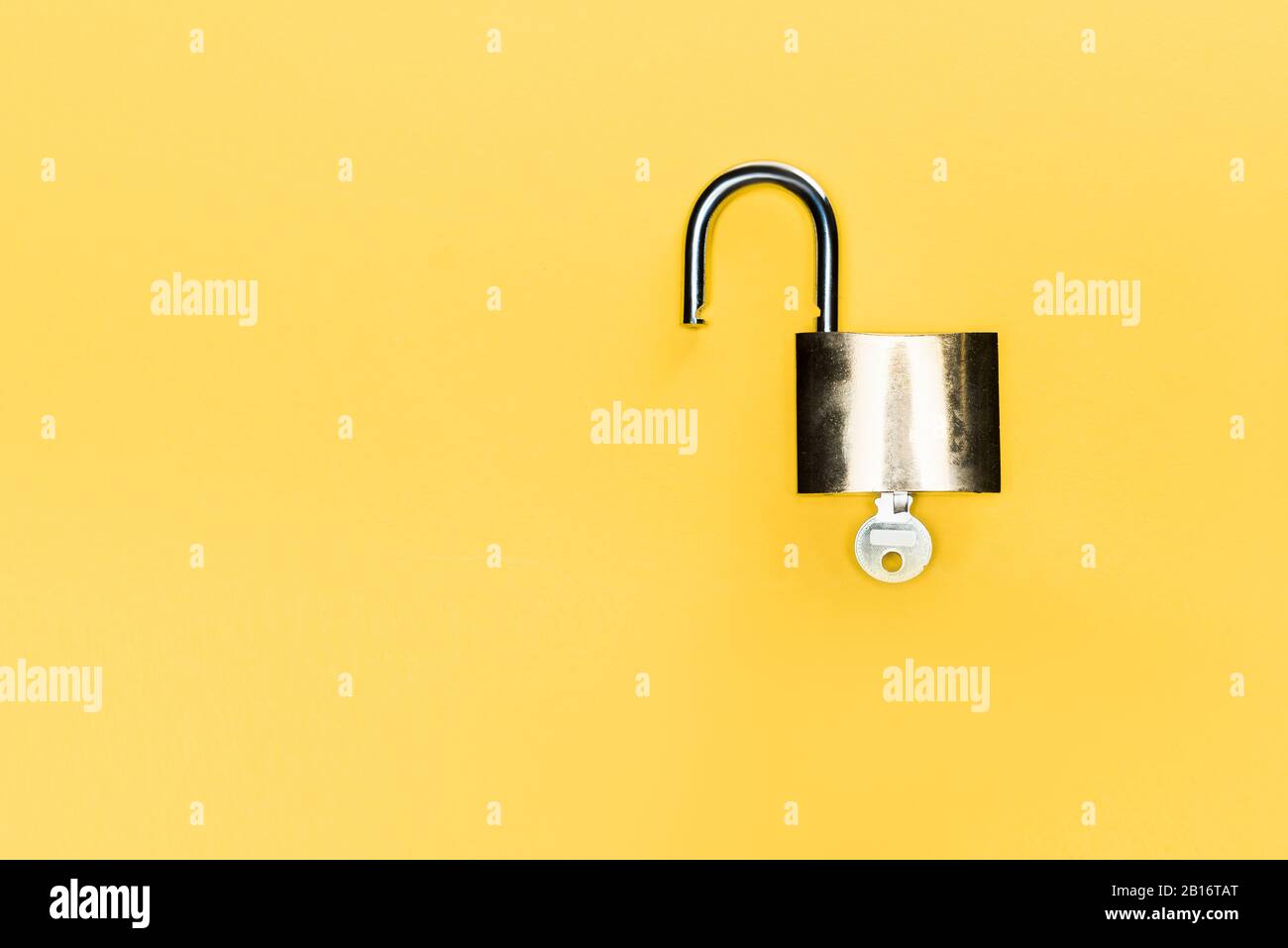 top view of metallic locker and key isolated on yellow Stock Photo - Alamy