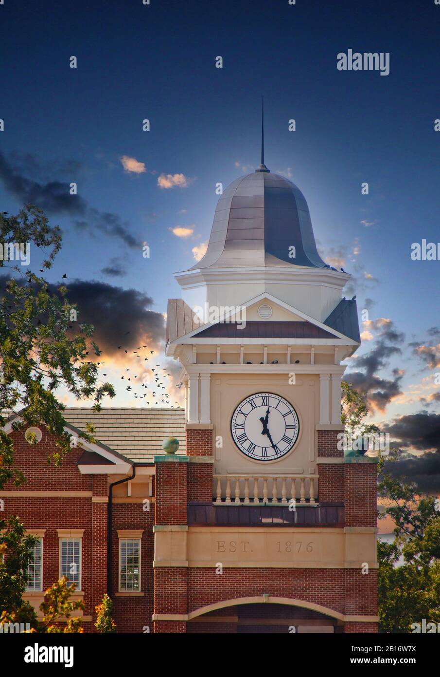 A vintage clock tower in a town square Stock Photo - Alamy