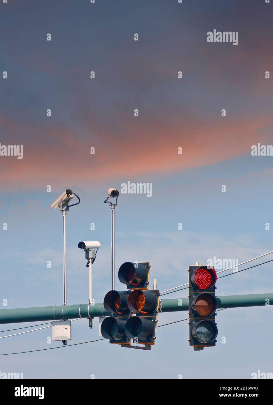 Traffic lights and enforcement cameras at a city intersection Stock ...