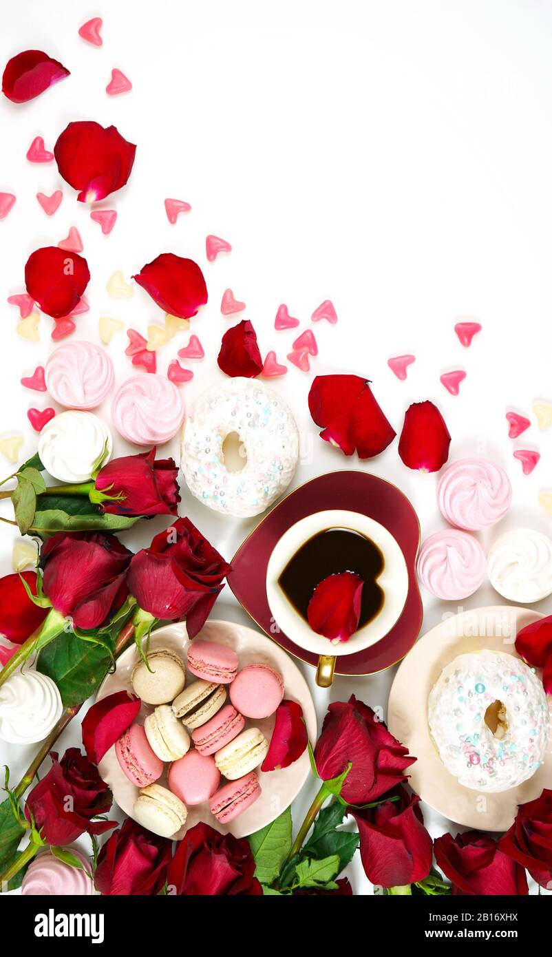 Red roses and morning tea creative composition flat lay layout with ...