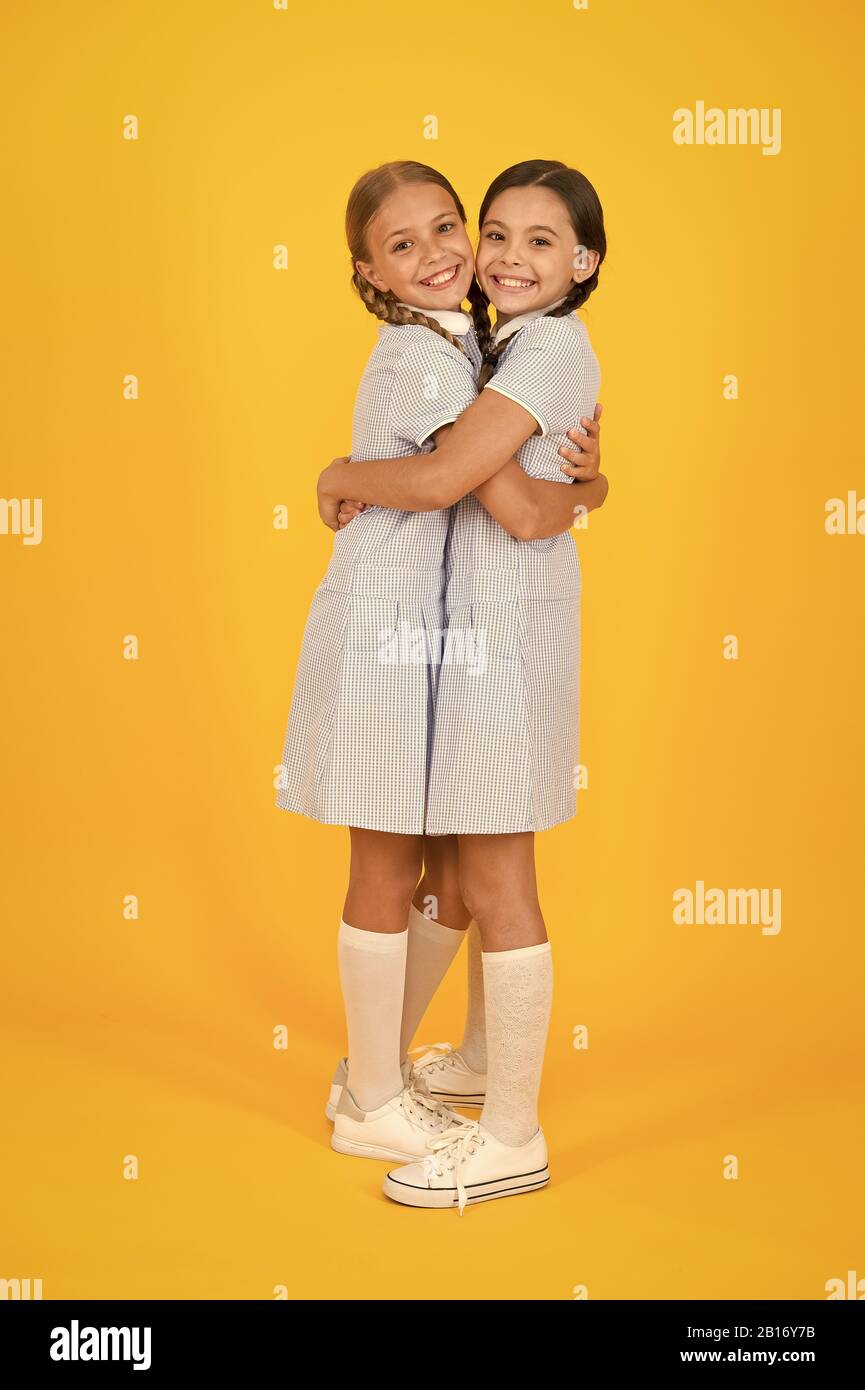 old school. kid fashion. happy friends embrace on yellow background ...