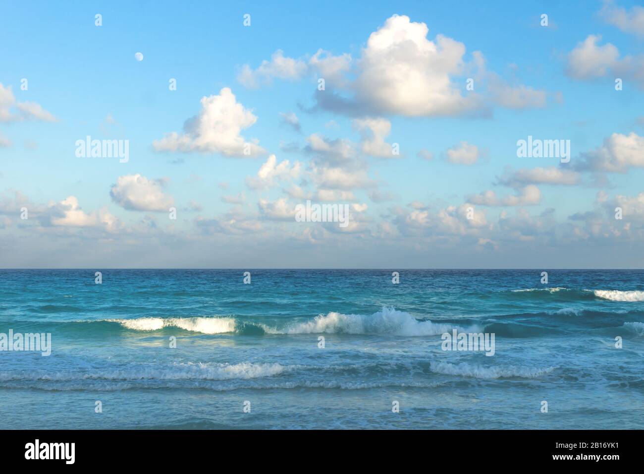Sea waves and moon with turquoise water during sunset at Cancun ...