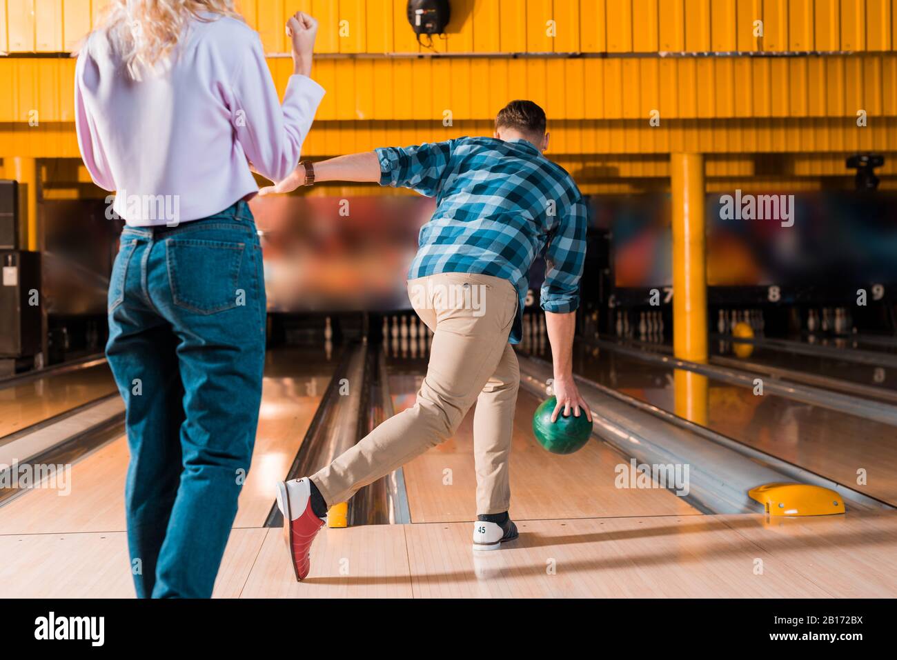 Young woman bowling back view hi-res stock photography and images - Alamy