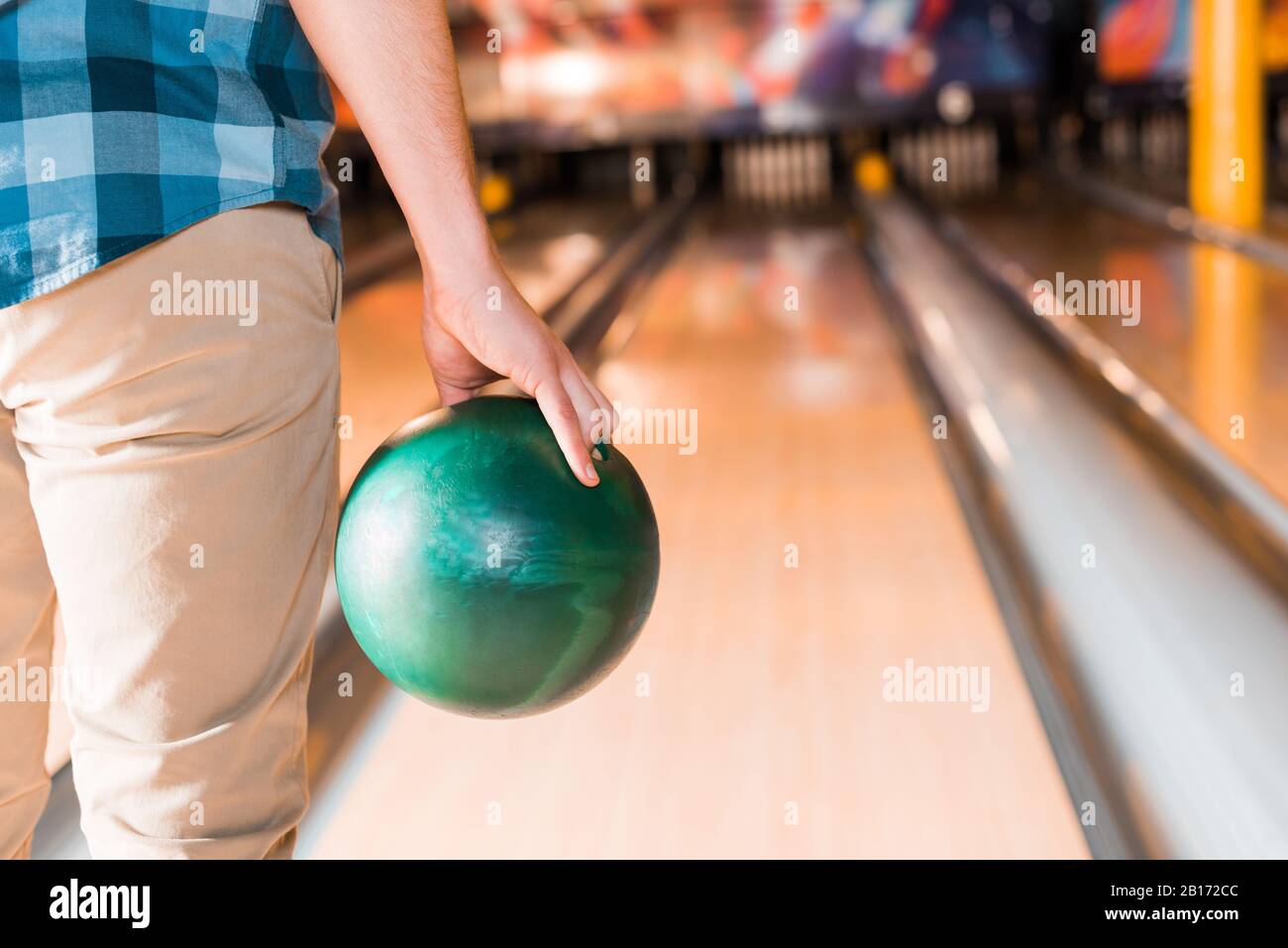 Man holding bowling ball hi-res stock photography and images - Alamy
