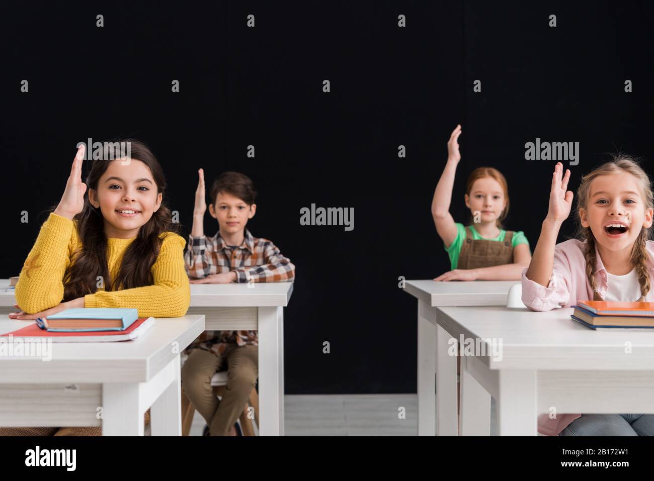 Children hands raised classroom hi-res stock photography and images - Alamy