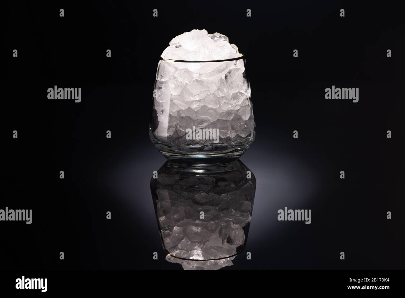 transparent glass with ice on black background Stock Photo - Alamy