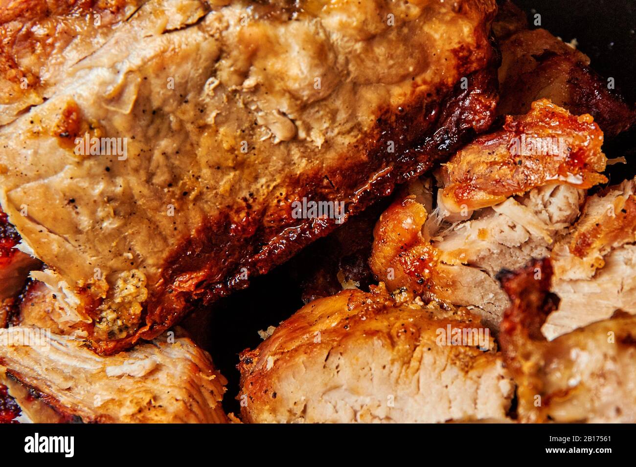 baked meat cut into pieces close up photo Stock Photo - Alamy