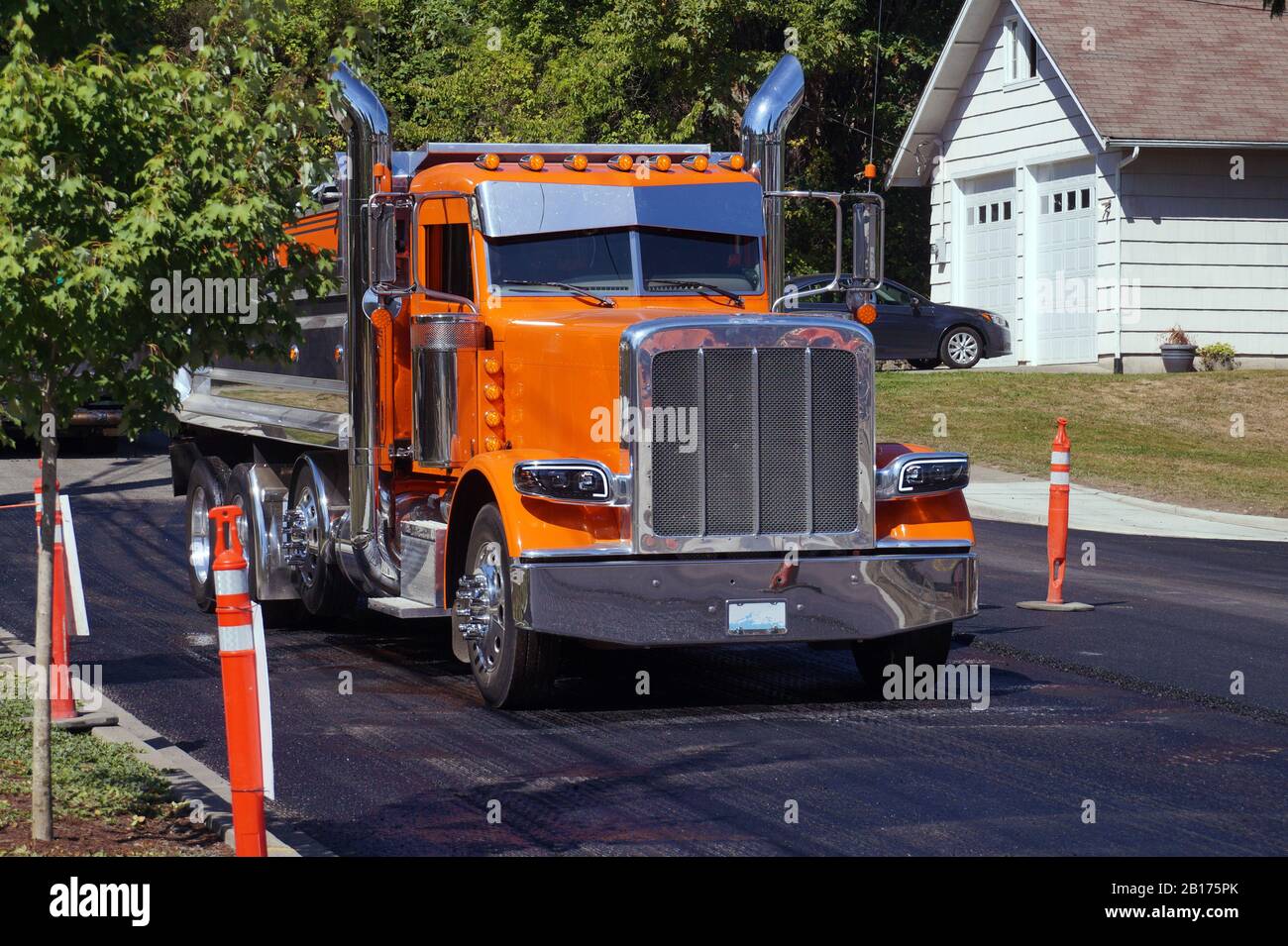 A city in the USA. Truck (dump truck) during street repair work Stock ...