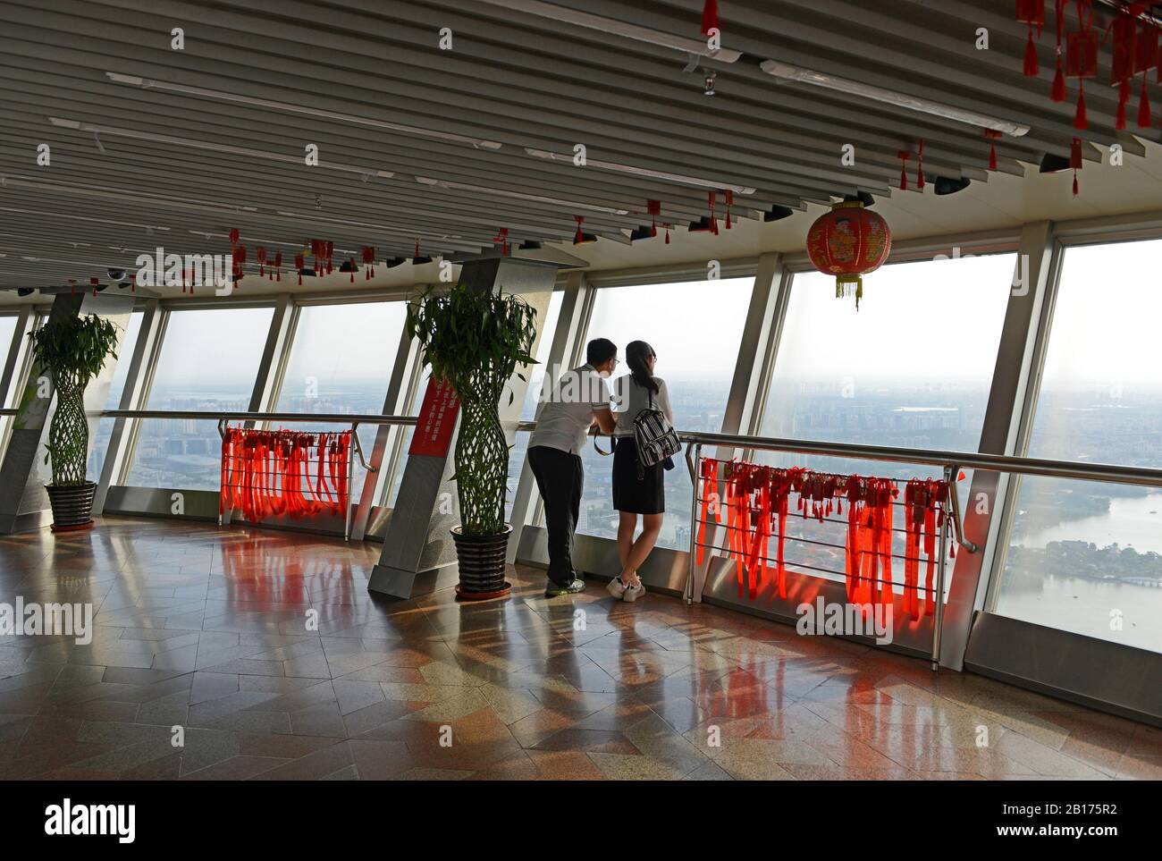 A couple admire the view from the viewing platform of the TV tower in ...
